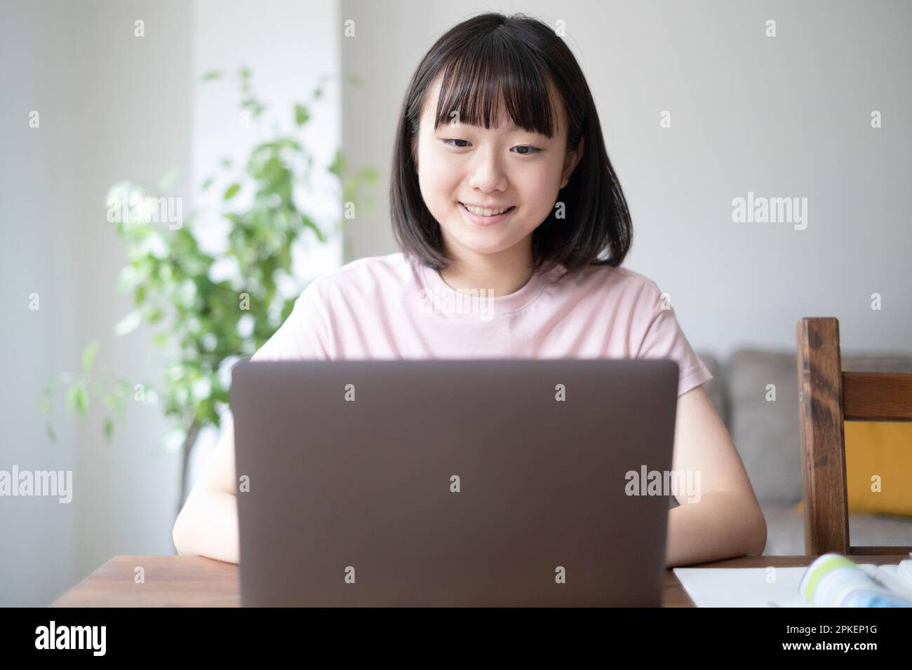 Girl touching computer Stock Photo - Alamy