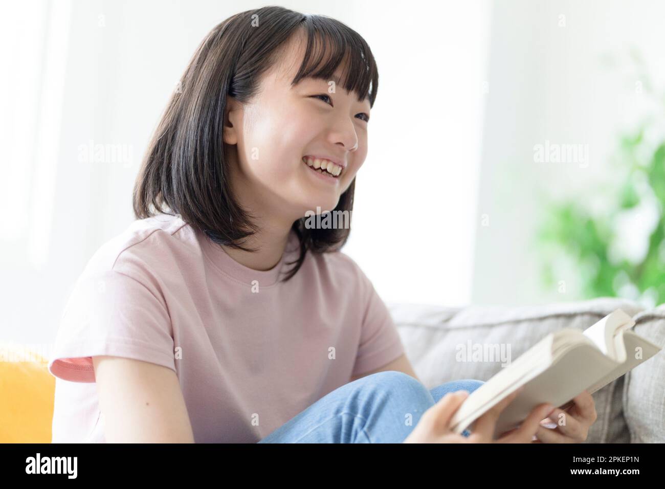 Junior high school girl reading book hi-res stock photography and ...