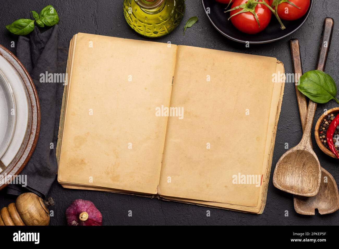 Top-down view of a kitchen table with ingredients, utensils, and an ...