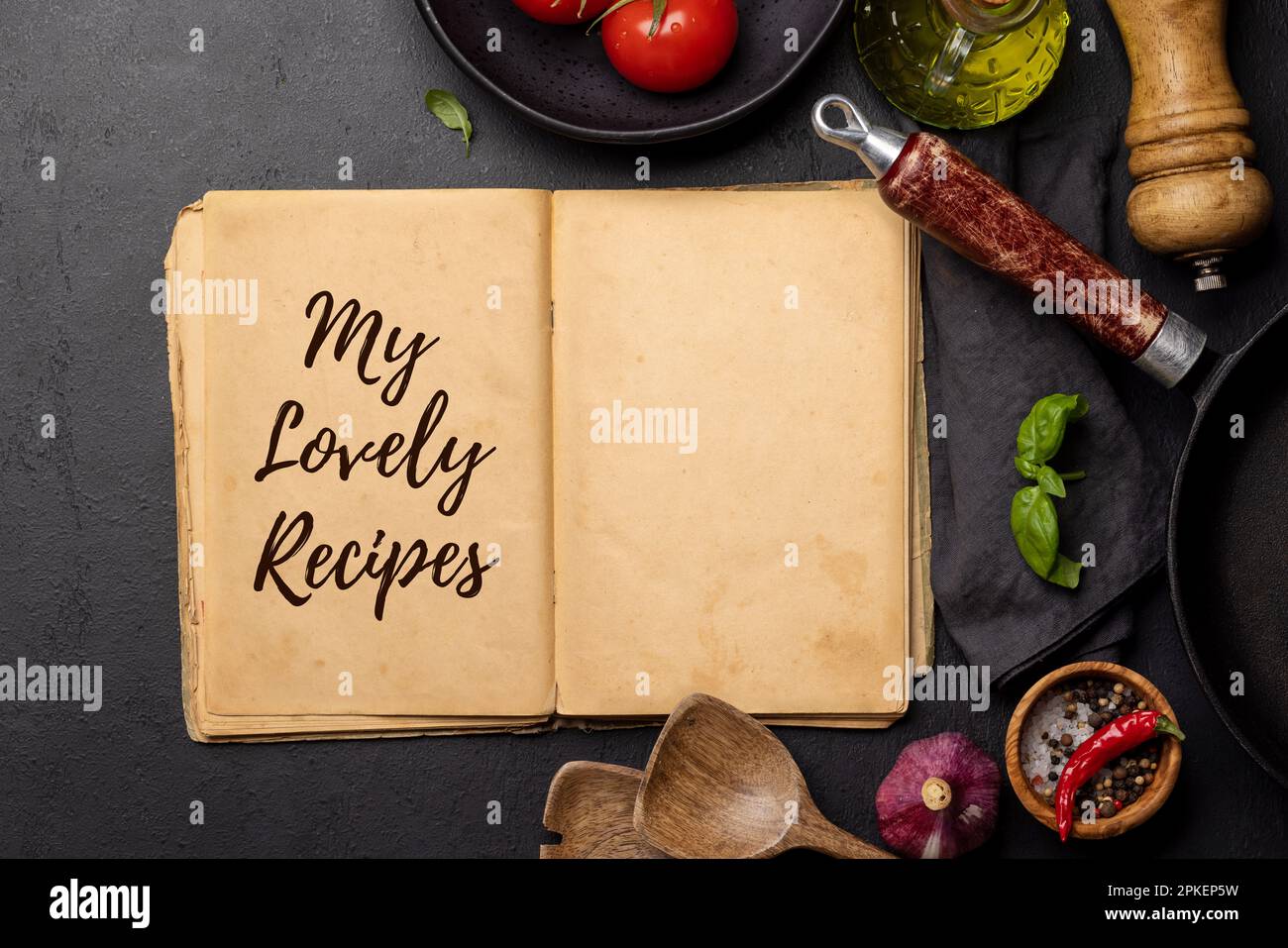 Top-down view of a kitchen table with ingredients, utensils, and an ...