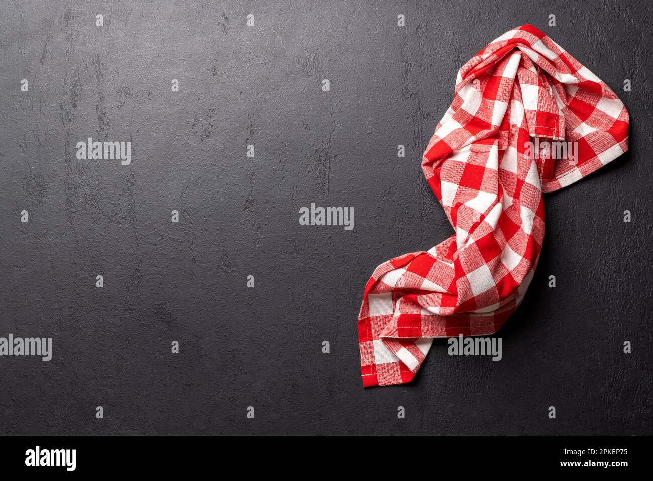 Top-down view of a kitchen table with a towel or napkin, creating a ...