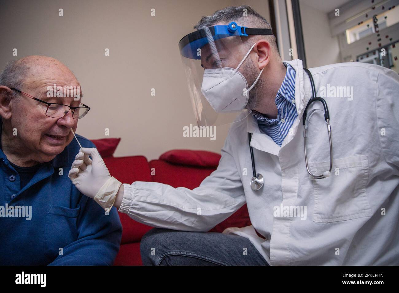 A doctor carries out a coronavirus test with a molecular swab on the ...