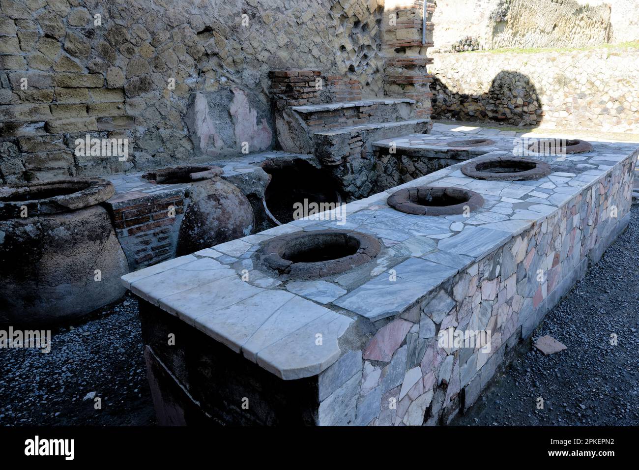 Large storage pots (Dolium) in a commercial food shop at Herculaneum ...