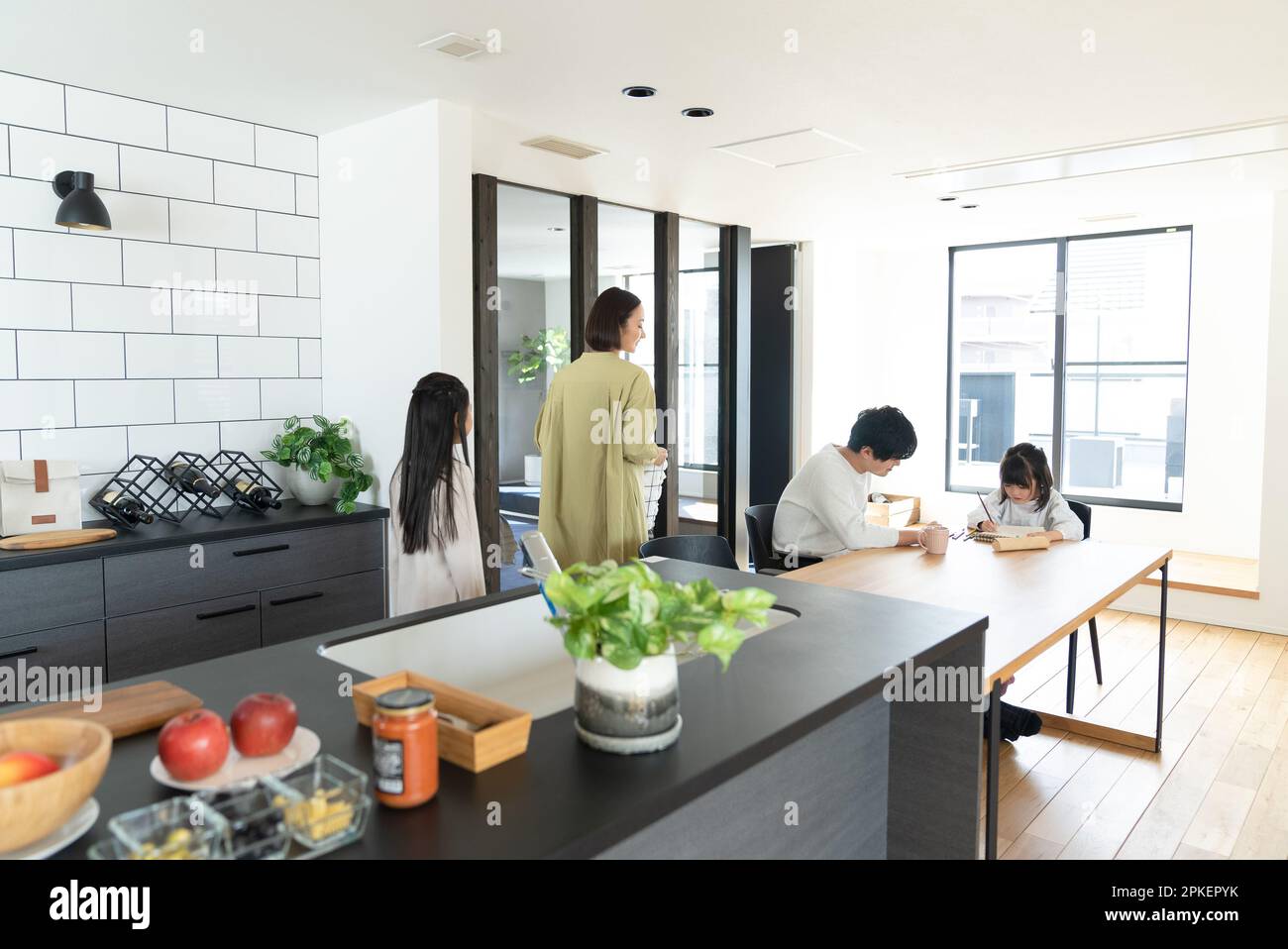 Parent and child doing housework and painting Stock Photo - Alamy
