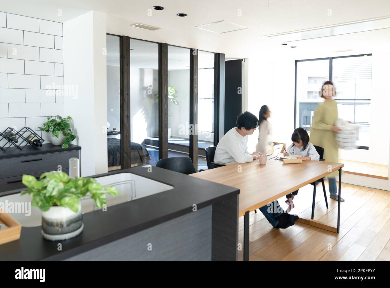 Parent and child doing housework and painting Stock Photo - Alamy
