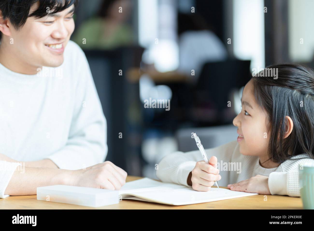 Girl doing homework Stock Photo - Alamy