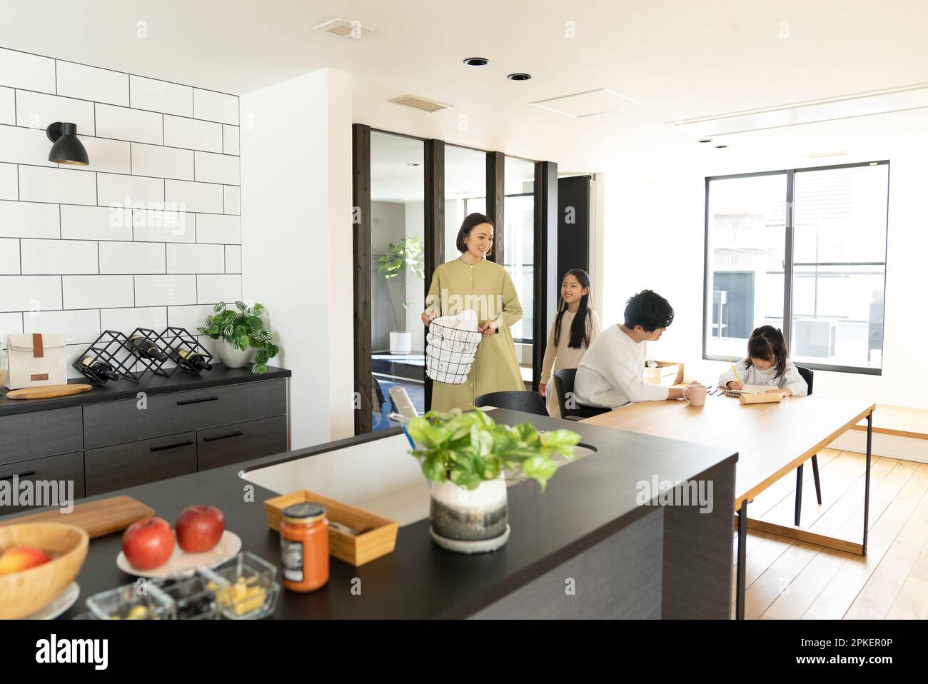 Parent and child doing housework and drawing Stock Photo - Alamy