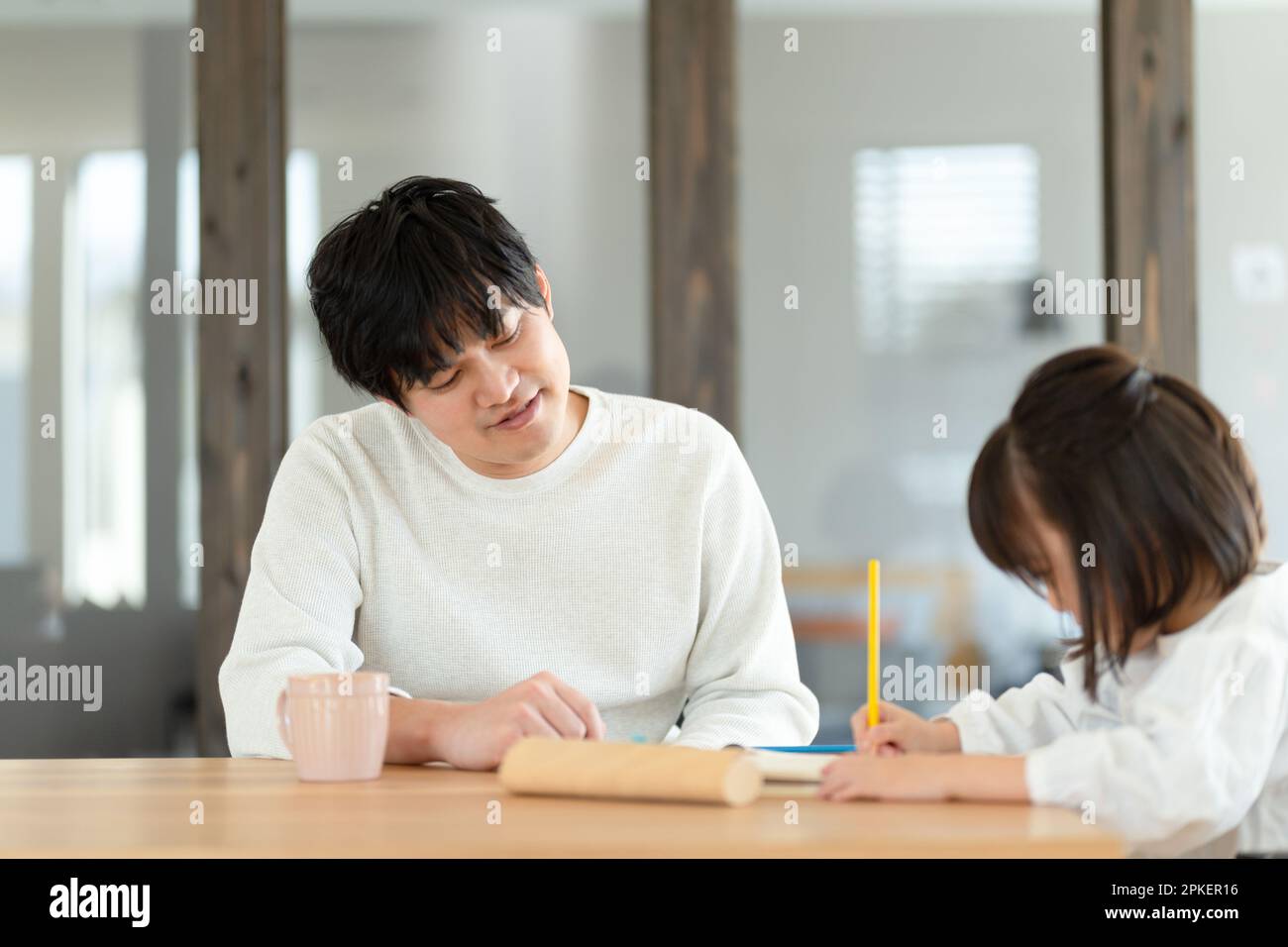Parents and children doing housework Stock Photo - Alamy