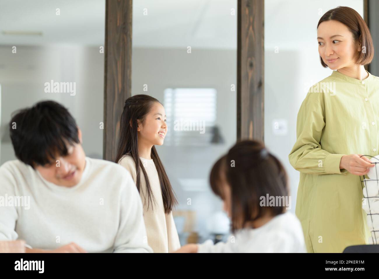 Parents and children doing housework and painting Stock Photo - Alamy