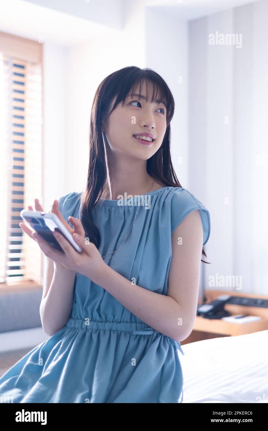 woman relaxing in hotel room Stock Photo - Alamy