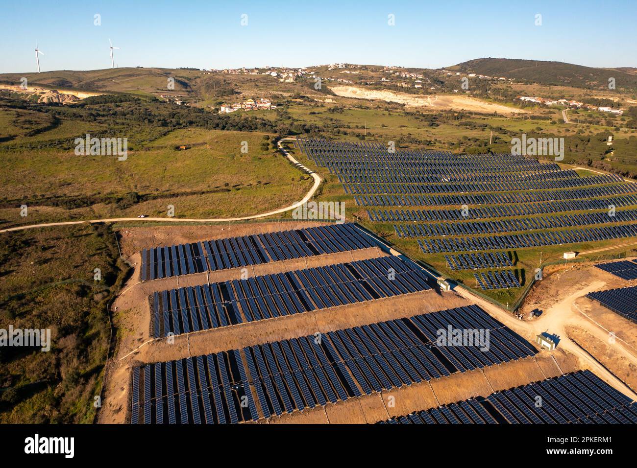 Long rows of photovoltaic panels at solar farm for converting energy of ...