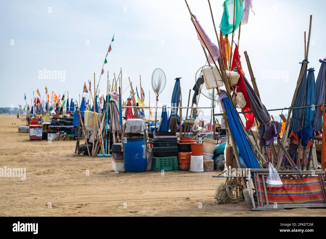 fishing accessories, tools and nets. Fishing nets collected on sand ...
