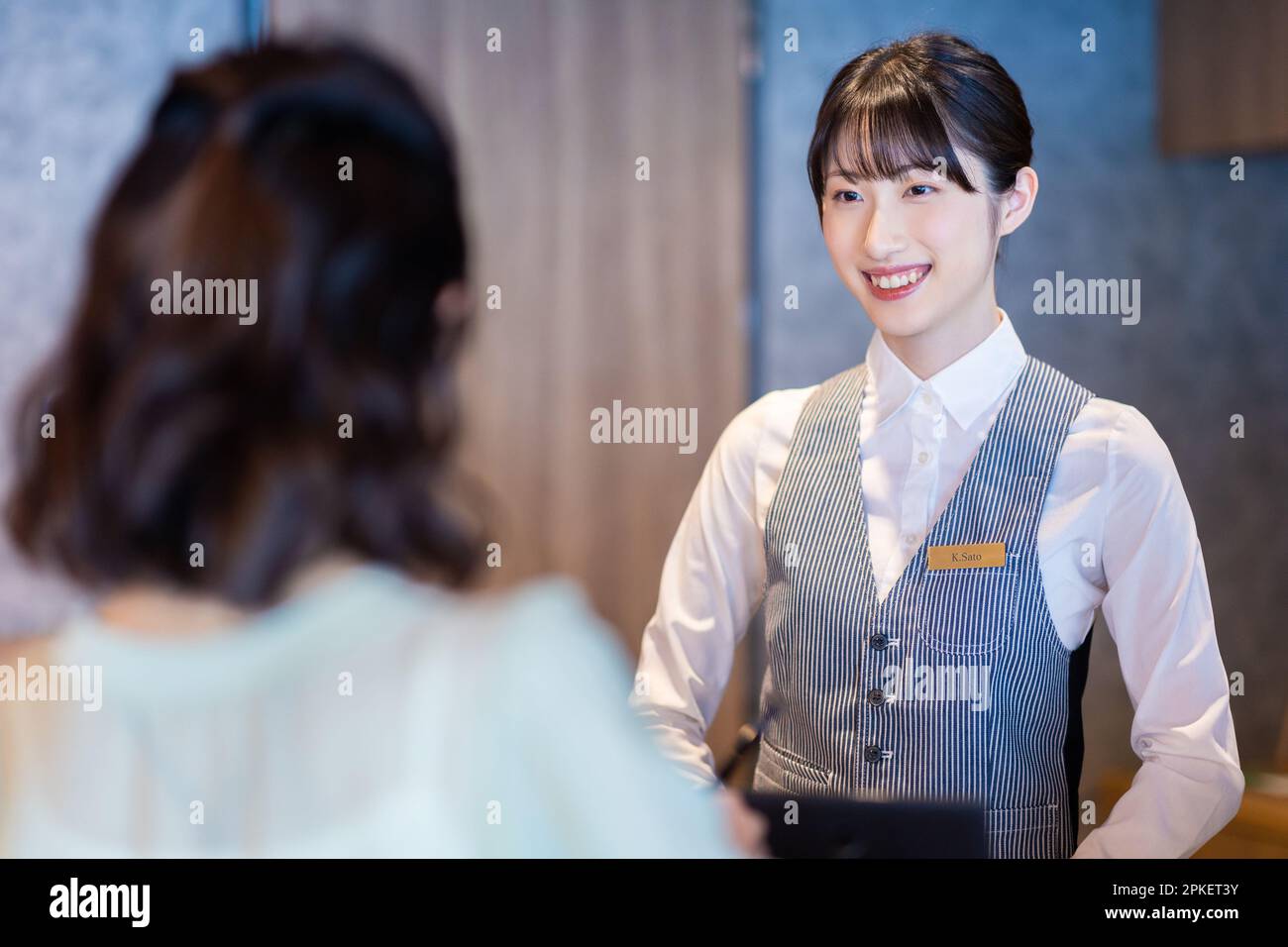 Hotel check-in counters Stock Photo - Alamy