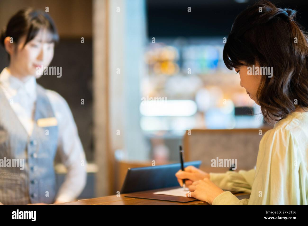 Hotel check-in counters Stock Photo - Alamy