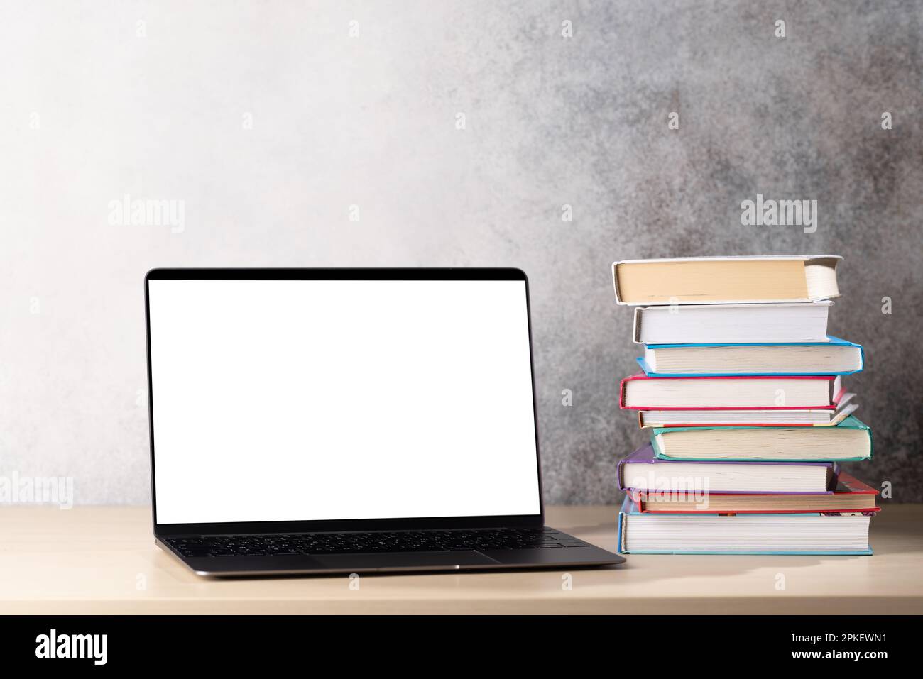 Laptop and books on desk. With blank screen for your text or app Stock ...