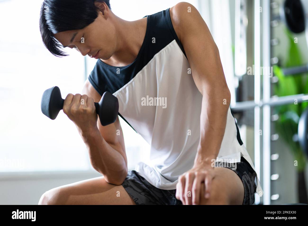 man doing strength training Stock Photo - Alamy