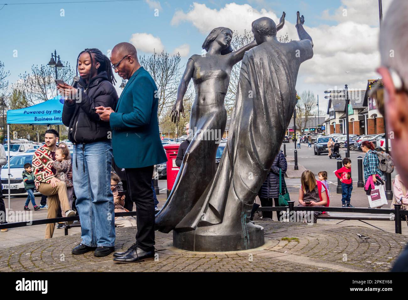 Staines, UK. 7 Apr 2023. A father & daughter read from the Bible ...