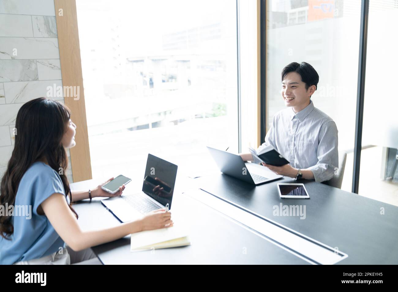 Businessmen and businesswomen at work Stock Photo - Alamy