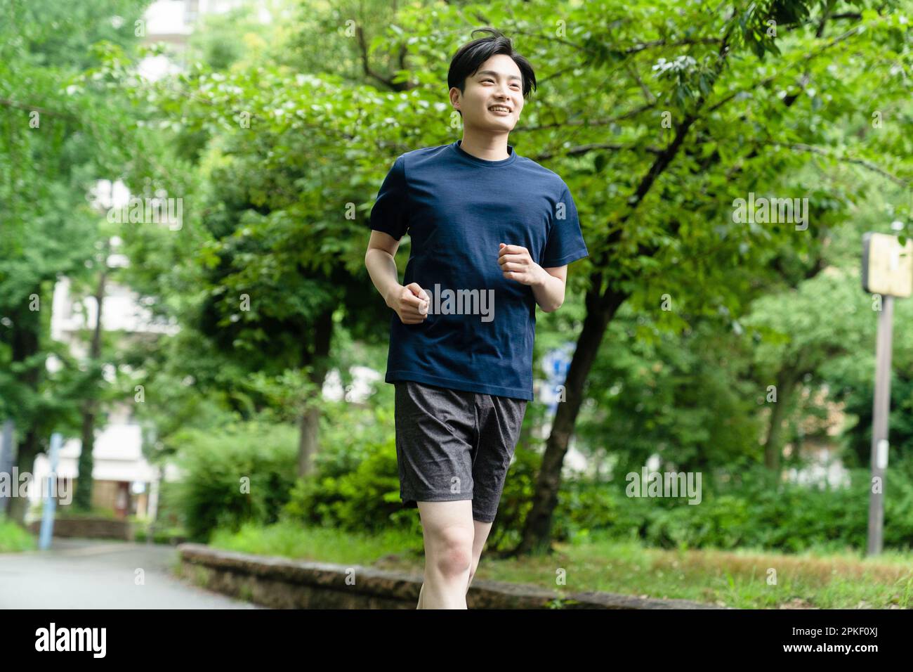 Young asian men running hi-res stock photography and images - Alamy