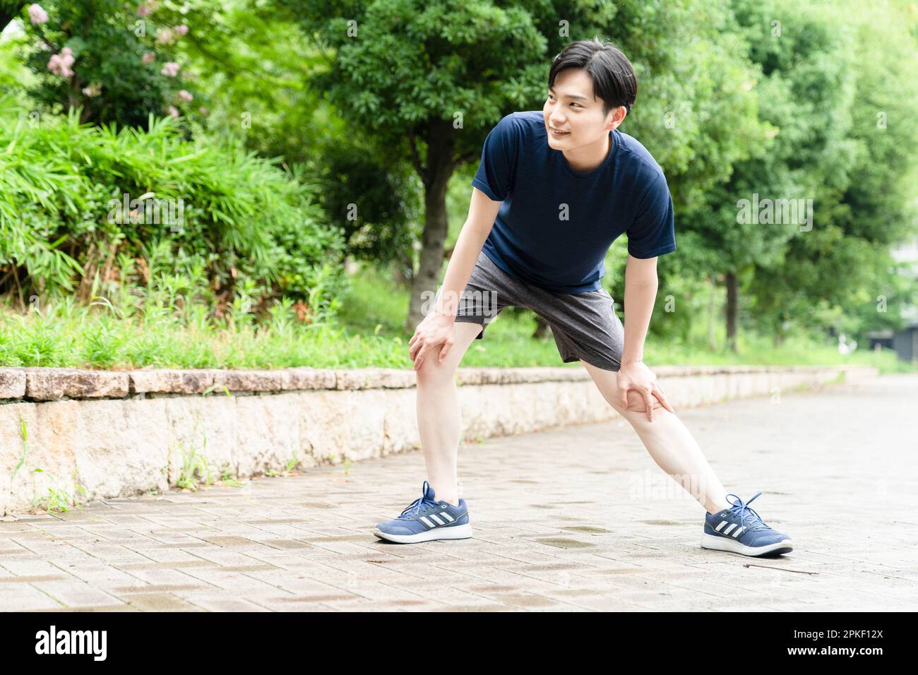 Training for marathon stretching hi-res stock photography and images ...