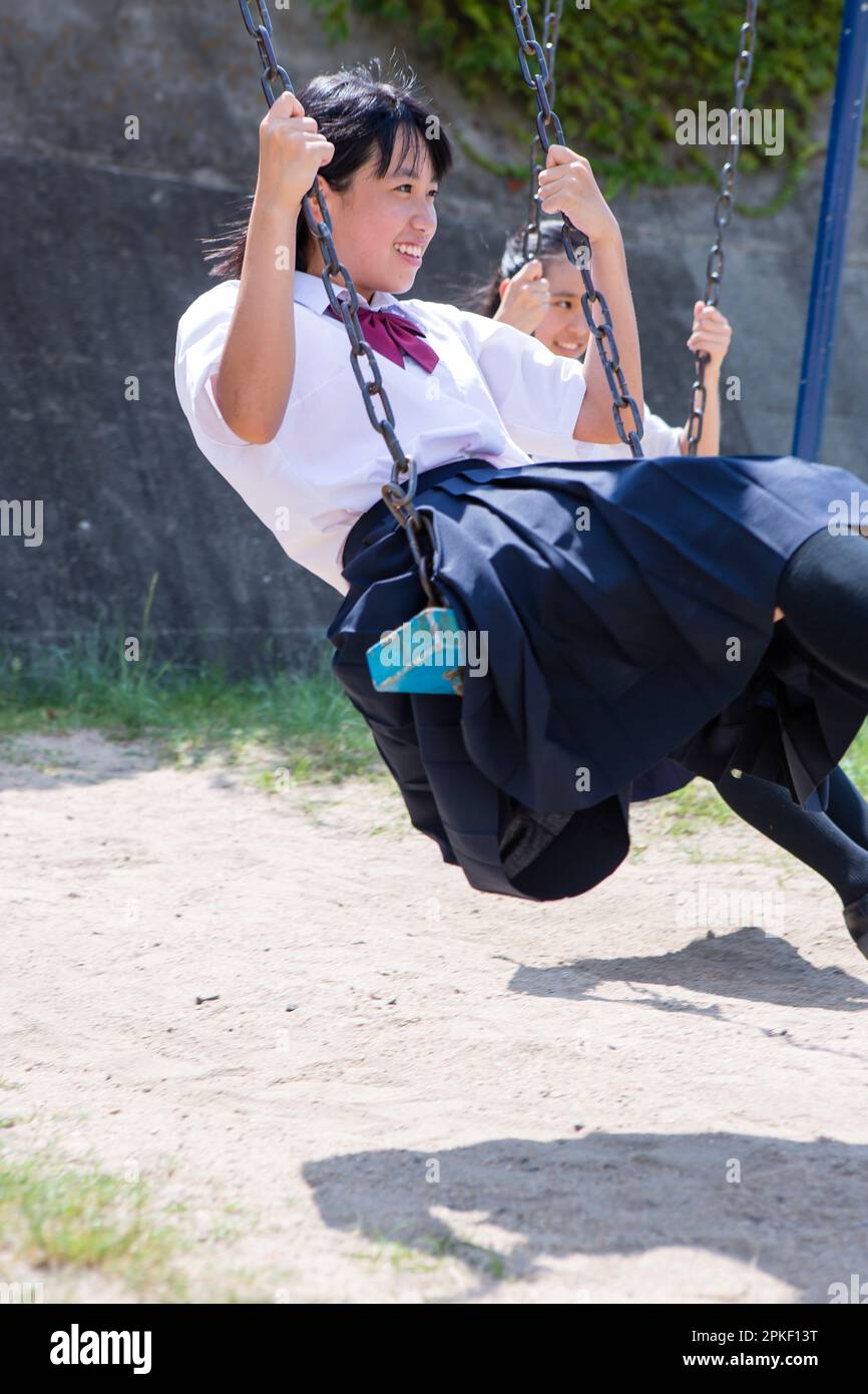 Junior High School Student Paddling on a Swing Stock Photo - Alamy