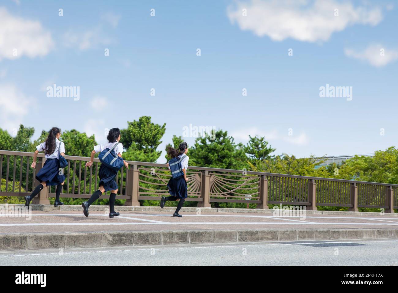 Junior High School Students Running on a Bridge Stock Photo - Alamy