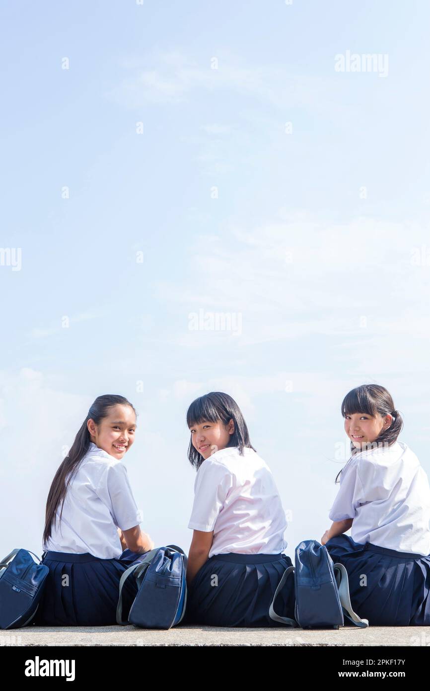 Junior High School Students Turning Around While Sitting on the ...