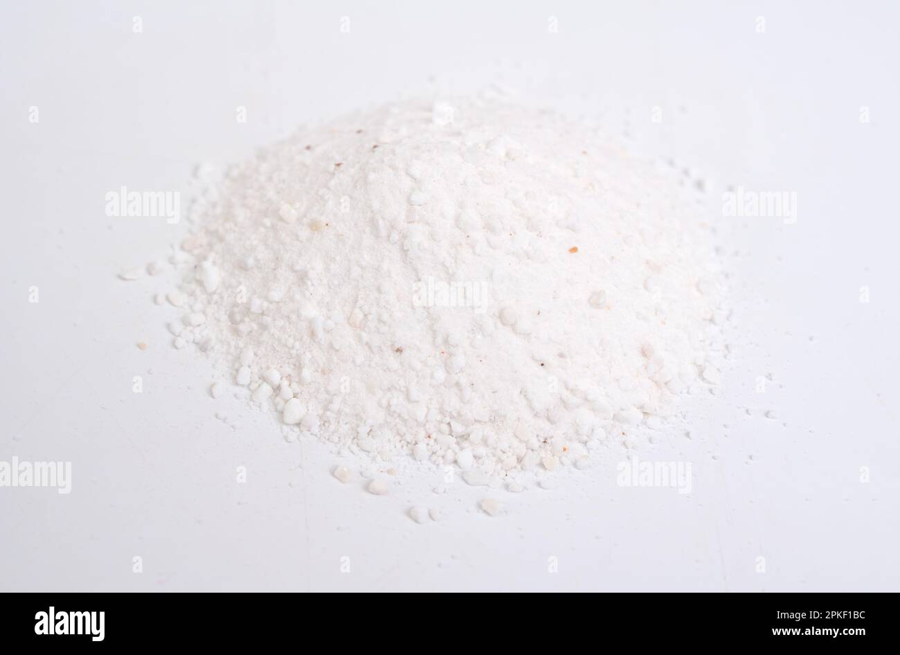 Dolomite mineral powder heep on white background Stock Photo - Alamy