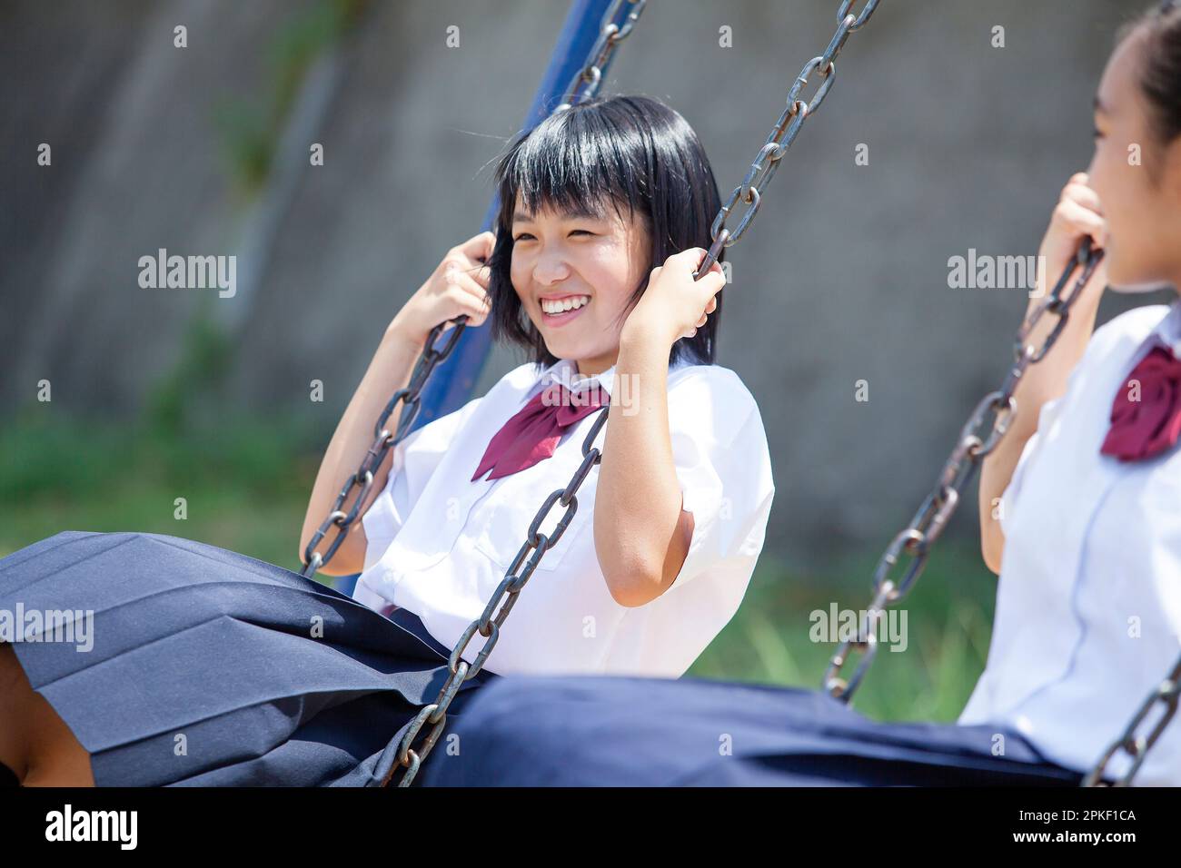 Junior High School Students Paddling on Swings Stock Photo - Alamy