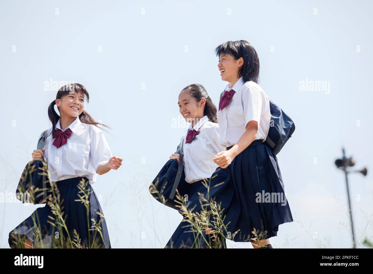 Junior high school students chatting while walking Stock Photo - Alamy Junior high school students chatting while walking Stock Photo - Alamy