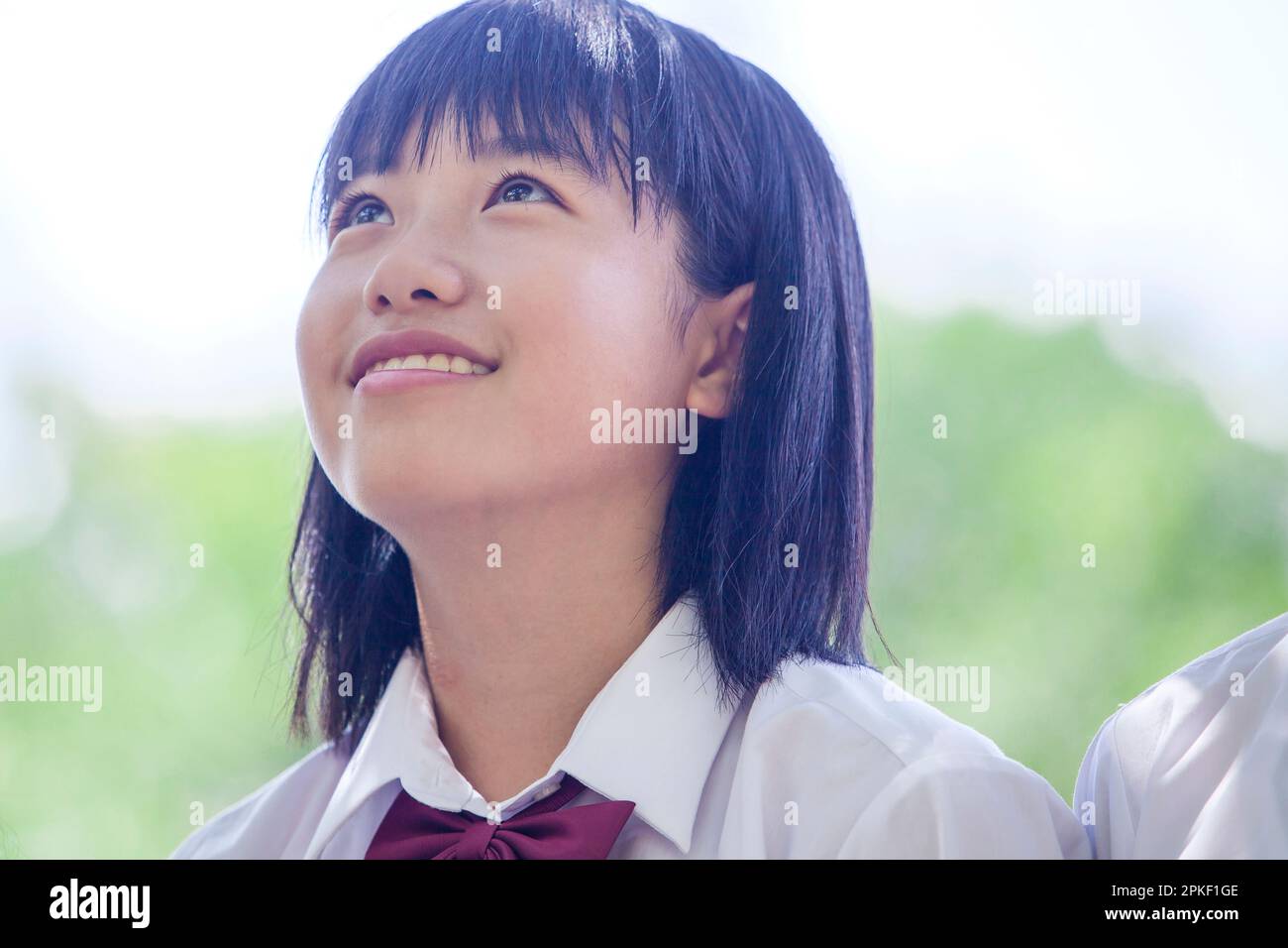 Standing junior high school students looking up Stock Photo - Alamy