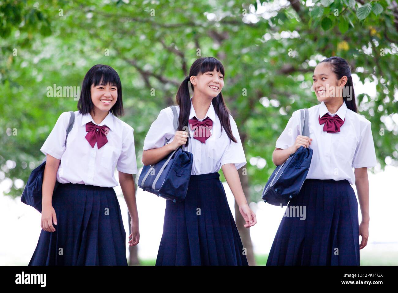 Junior high school students walking side by side Stock Photo - Alamy
