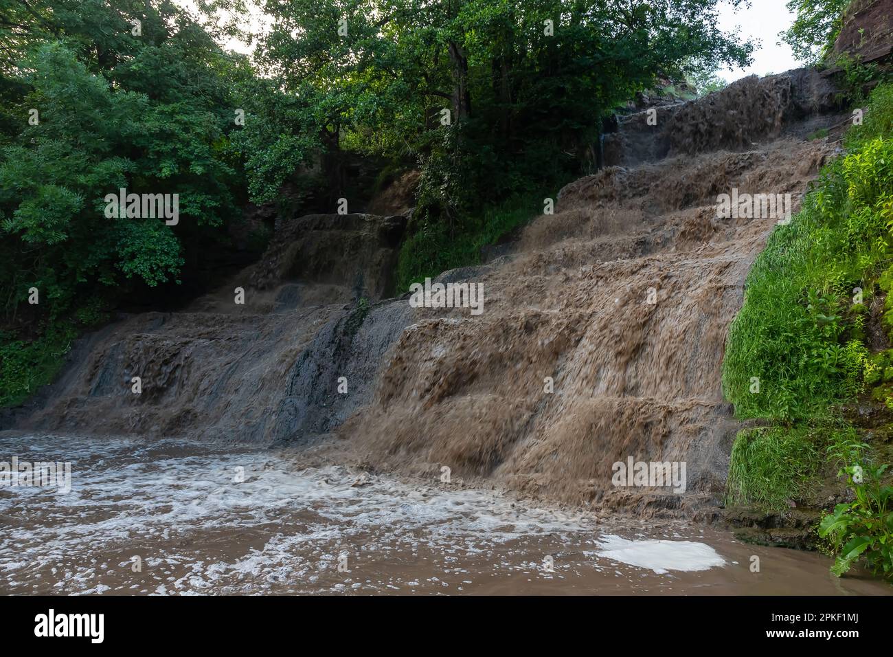 powerful waterfall with dirty water after the hard rain Stock Photo - Alamy