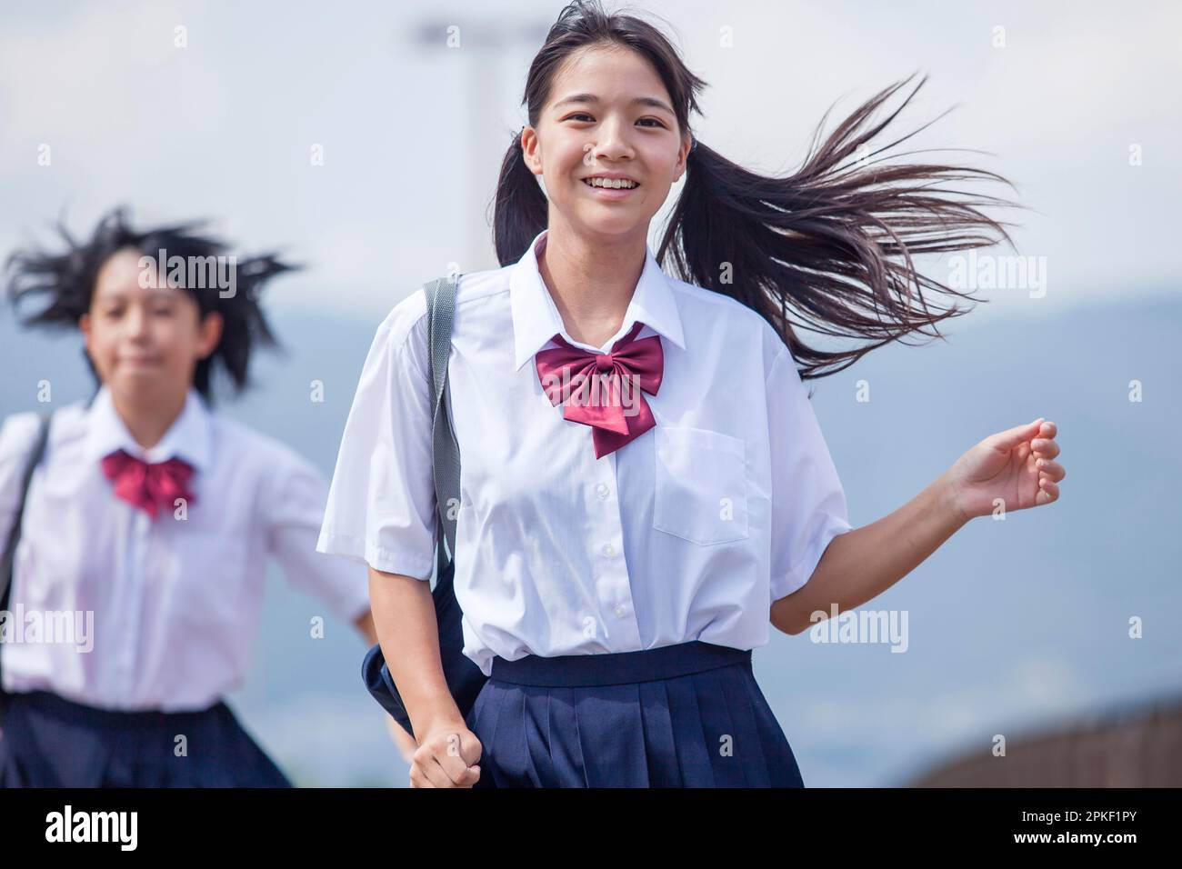 Junior high school students running side by side Stock Photo - Alamy