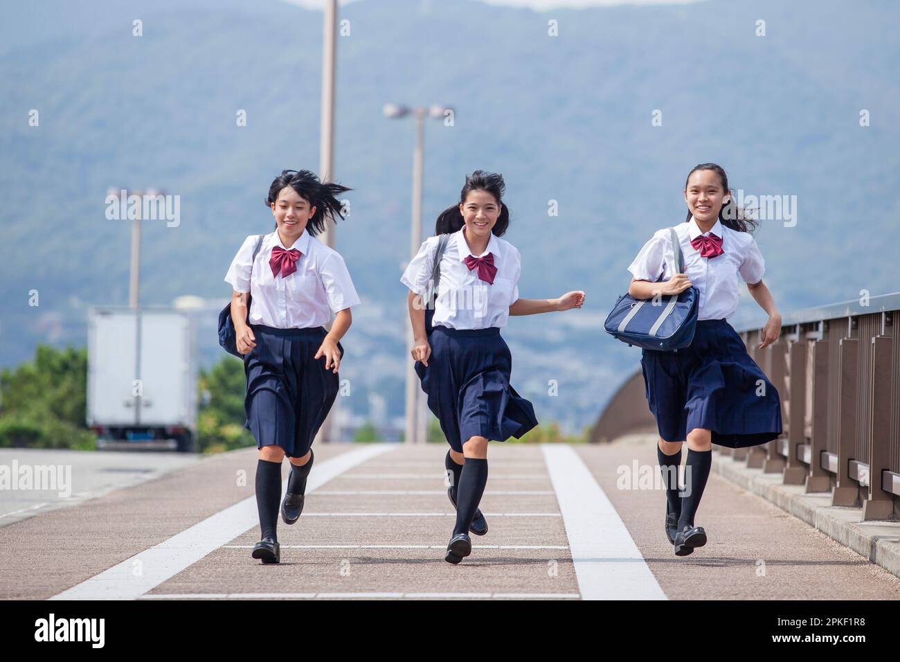 Junior high school students running in a line Stock Photo - Alamy