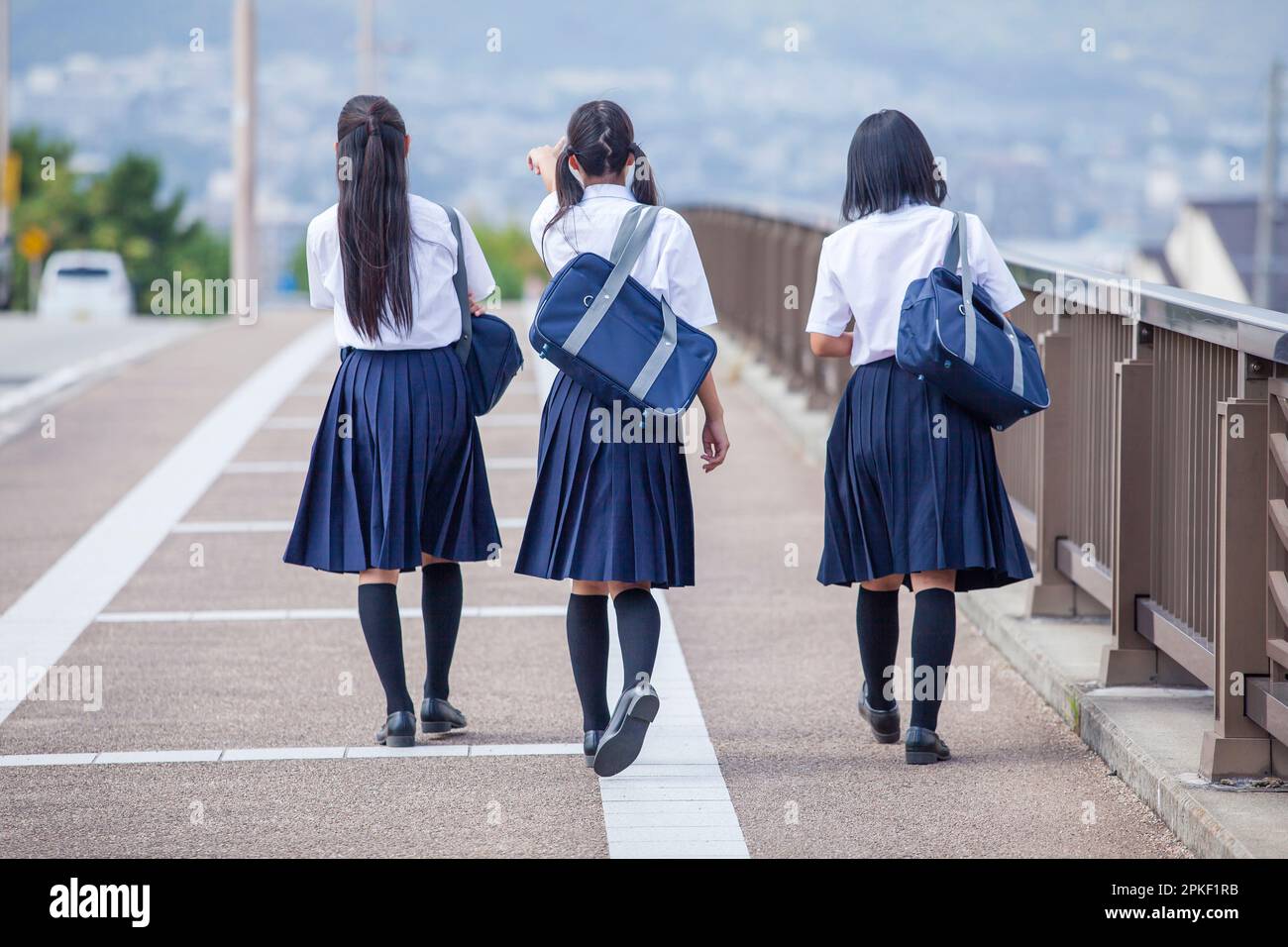 Junior high school students walking side by side Stock Photo - Alamy