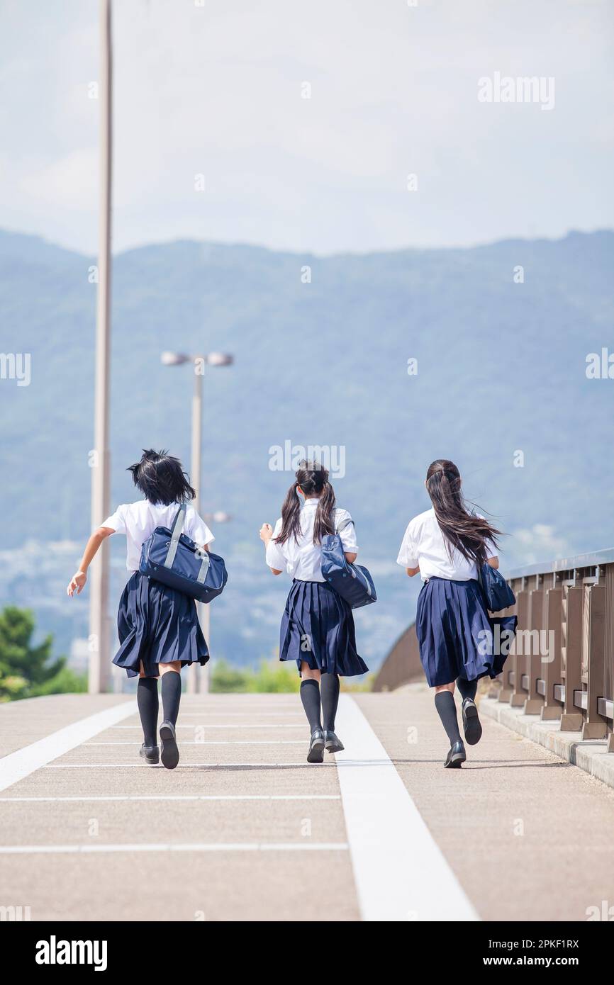 Junior high school students running side by side Stock Photo - Alamy