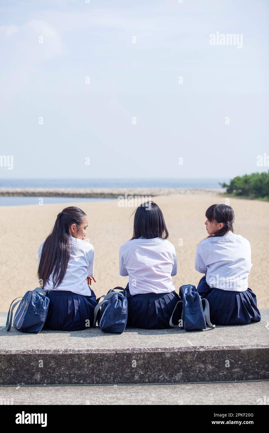 Junior high school students sitting in a row Stock Photo - Alamy