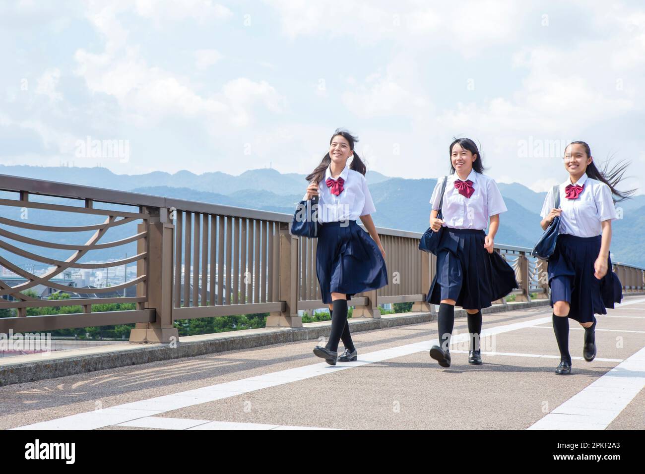 Junior high school students walking side by side Stock Photo - Alamy