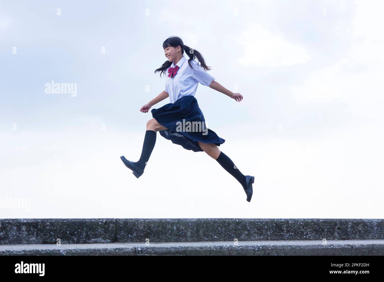 Students jumping beach hi-res stock photography and images - Alamy
