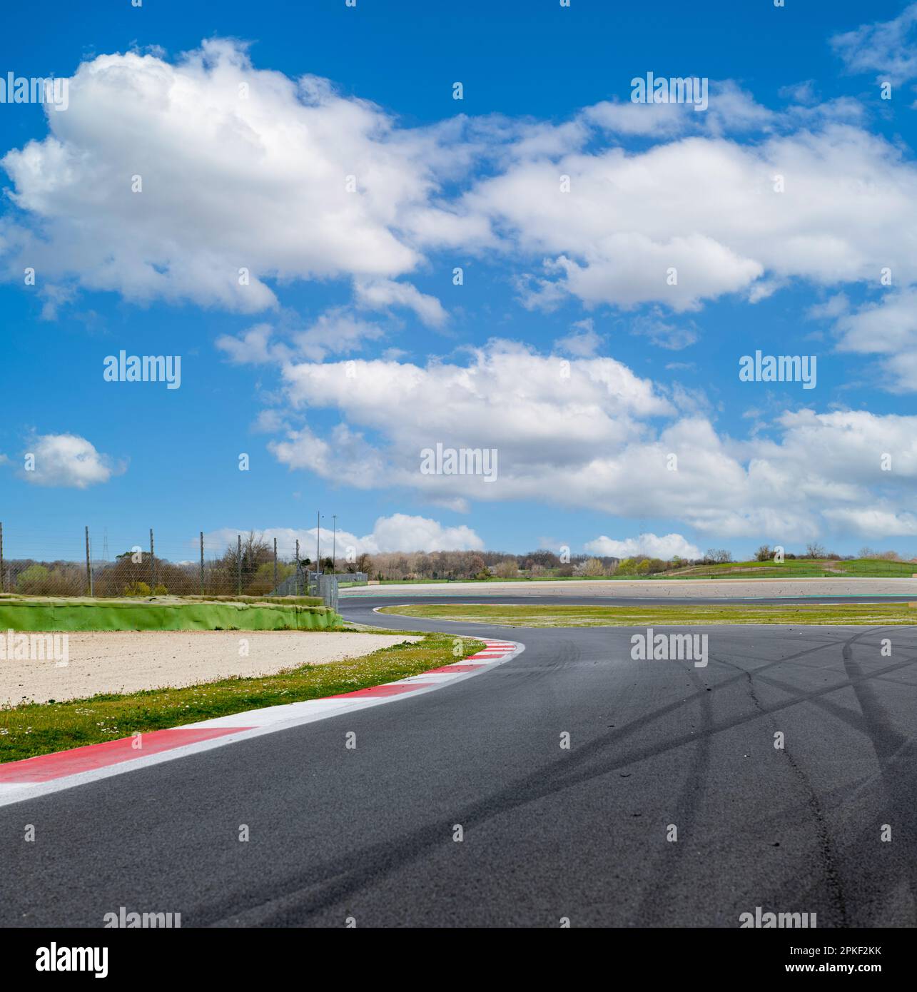 Motor sport asphalt race track and curbs with skid marks, low angle ...