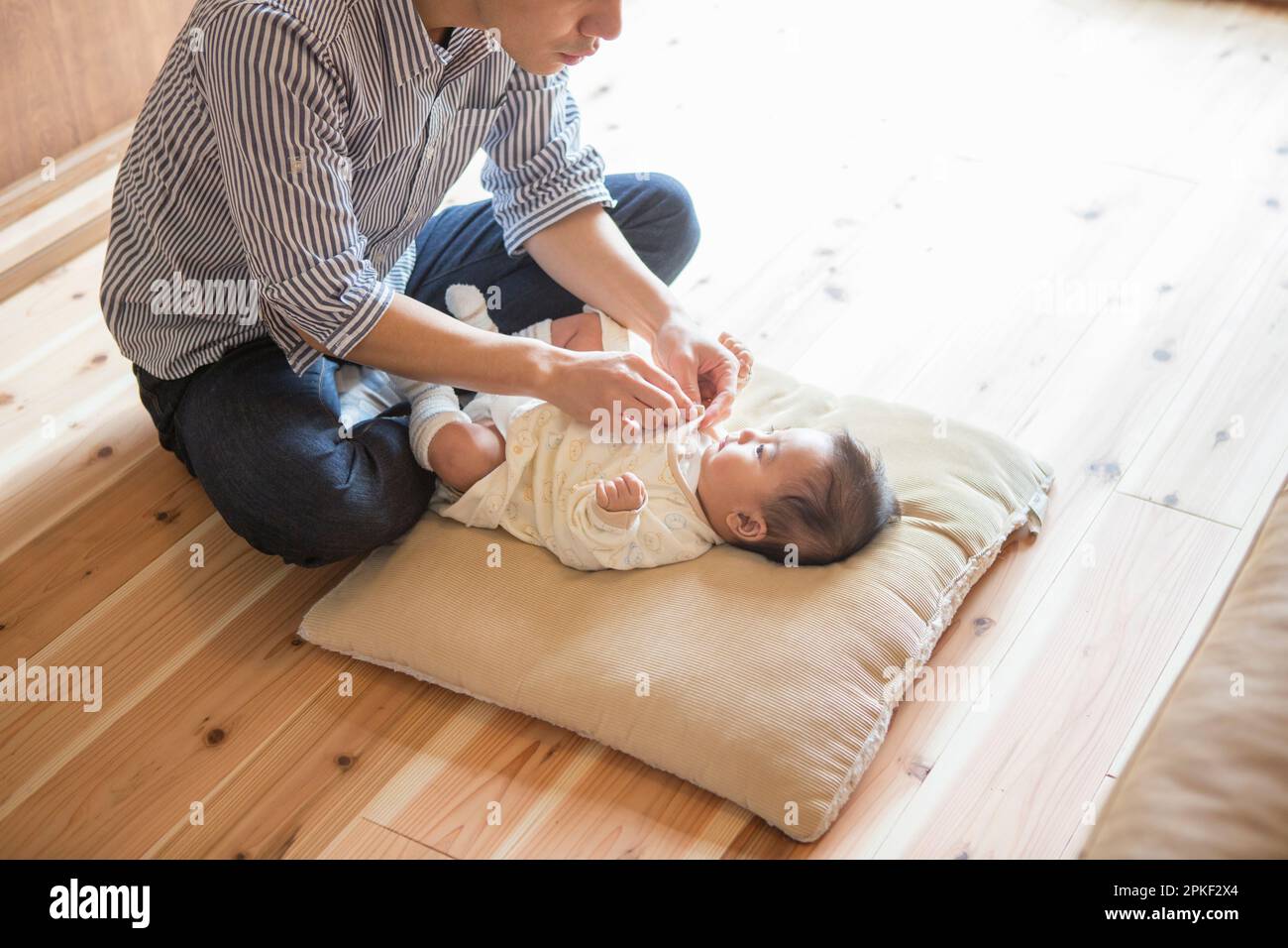 Father taking care of his child Stock Photo - Alamy