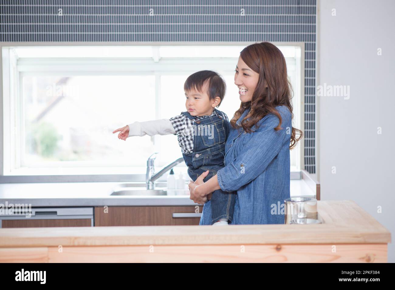 Mother holding child Stock Photo - Alamy