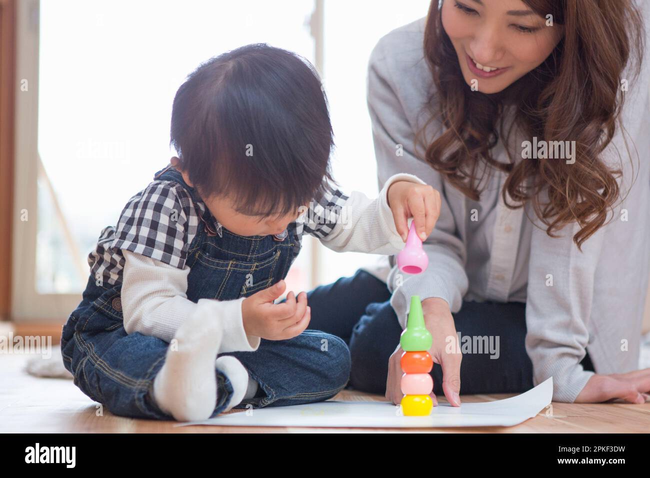 Boy playing with toys Stock Photo - Alamy
