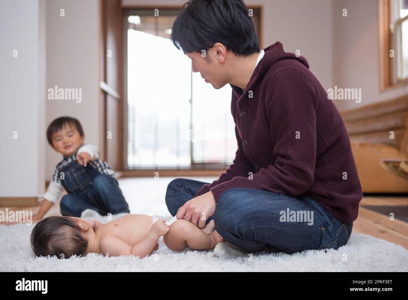 Father taking care of child Stock Photo - Alamy