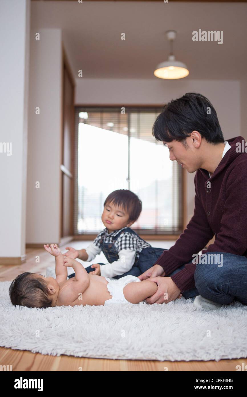 Fathers caring for a child Stock Photo - Alamy