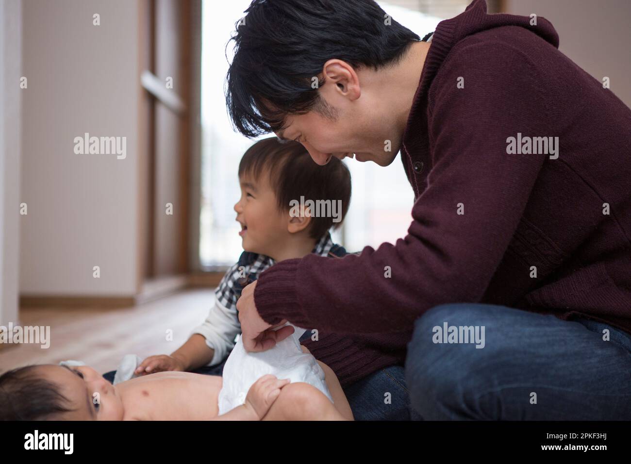 Father taking care of a child Stock Photo - Alamy