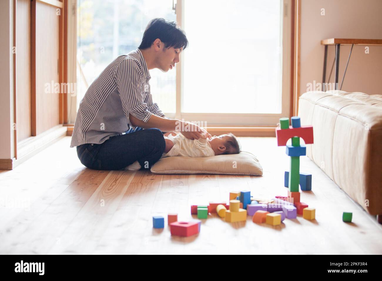 Father taking care of baby Stock Photo - Alamy