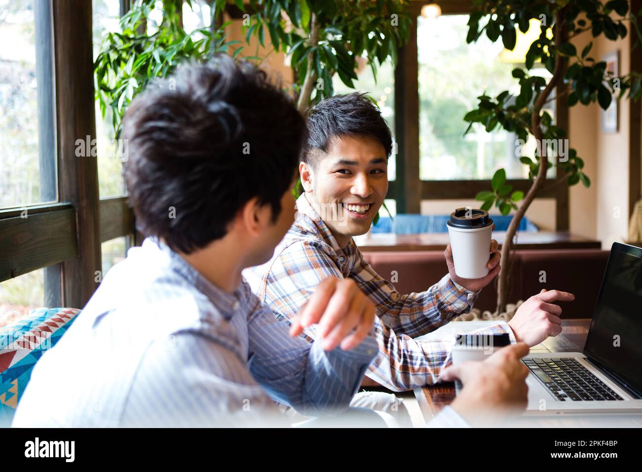 Two men stand talking hi-res stock photography and images - Alamy