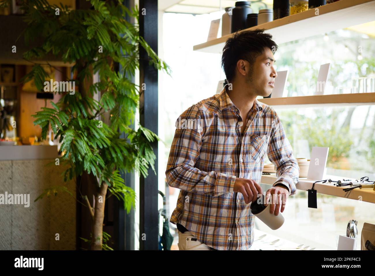 Men relaxing at a cafe Stock Photo - Alamy